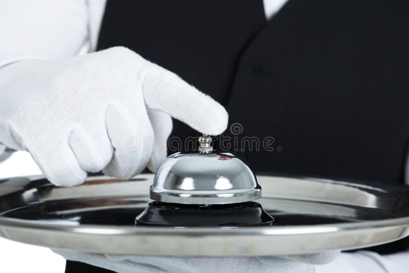 Butler Holding Service Bell Stock Image - Image of bowtie, isolated ...