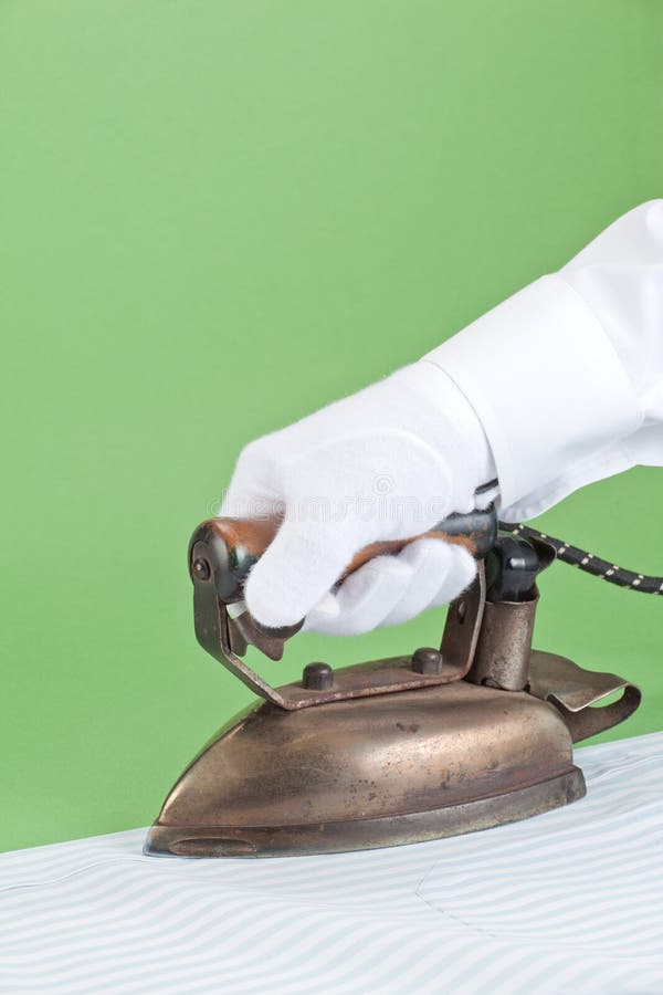 Butler ironing stock image. Image of historical, green - 63478157
