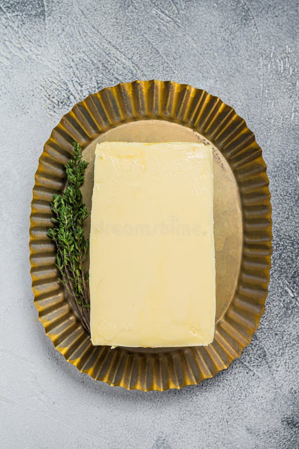 Butter Block on Steel Plate. White Background Stock Image - Image of ...