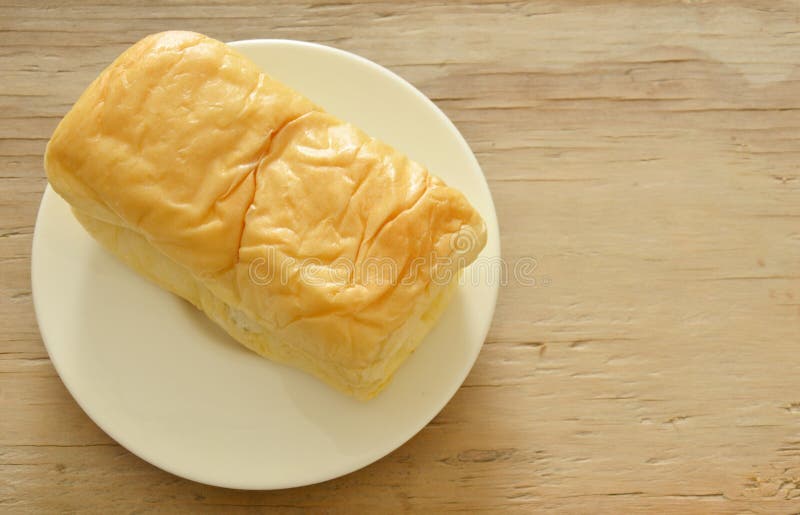 Butter Bread Loaf on White Dish Stock Photo - Image of dish, breakfast ...