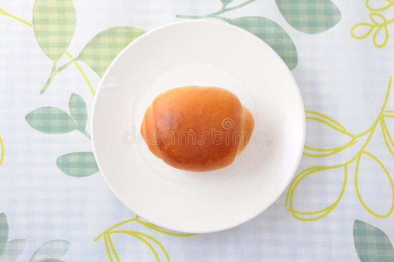 Butter Bread Roll on a Plate on Tablecloth Stock Image - Image of ...