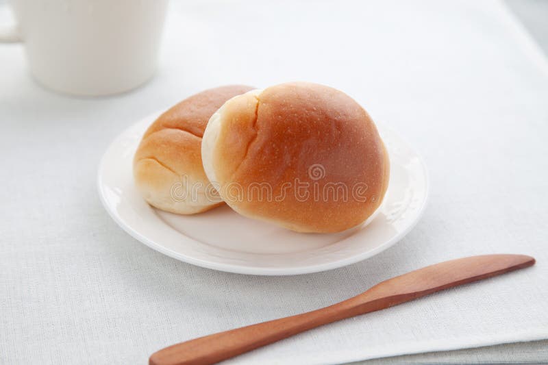 Butter Bread Table Rolls on Plate Isolated on Table Stock Photo - Image ...