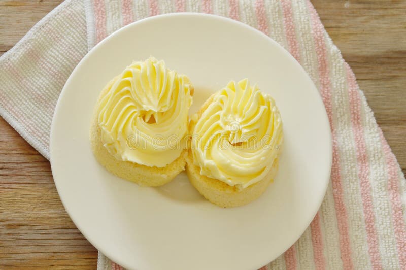 Butter Cake Roll Topping Vanilla Cream on Plate Stock Photo - Image of ...