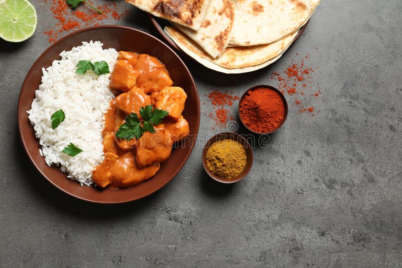 Butter Chicken with Rice Served on Grey Table, Flat Lay. Stock Photo ...
