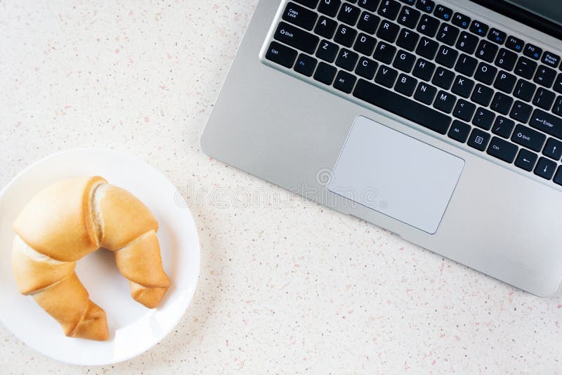 Butter Croissant and Silver Laptop in the Table Stock Image - Image of ...