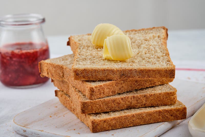 Butter Curl on Toast Bread. Healthy Breakfast with Bran Bread Toast ...