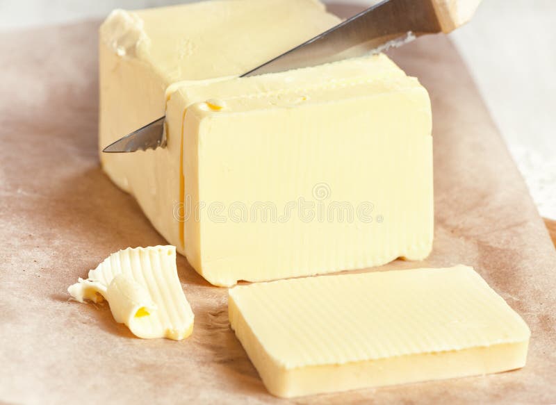 Butter cutting by knife stock photo. Image of cube, closeup - 33509464