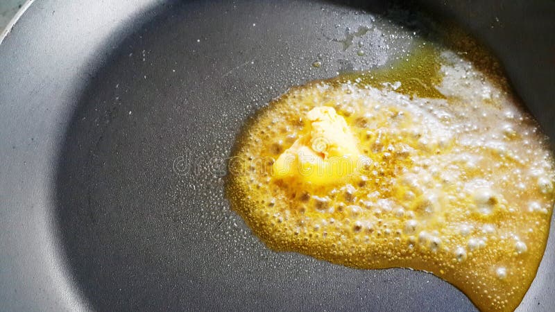 Butter melted in a hot pan stock photo. Image of wallpaper - 156044658
