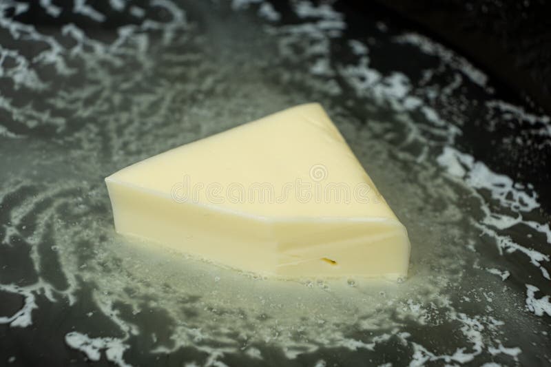 Butter is Melted in a Pan, the Process of Frying in Butter. Stock Photo ...