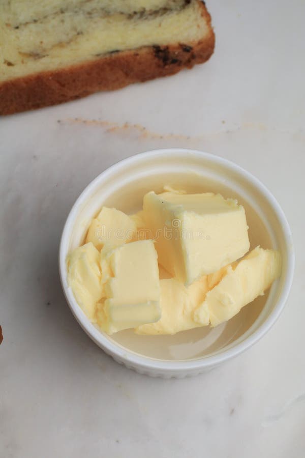 Butter Pieces in Bowl on White Background. Farm Dairy Products Stock ...
