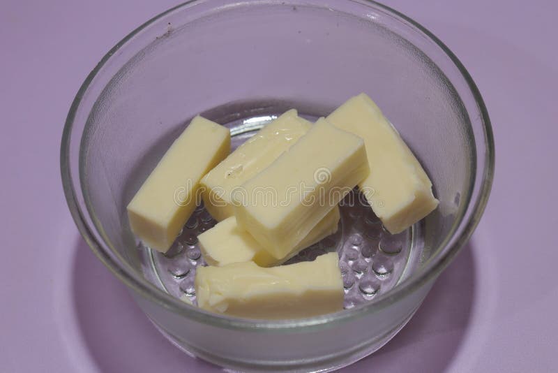 Butter Pieces in Glass Bowl Isolated on Black Background Stock Photo ...