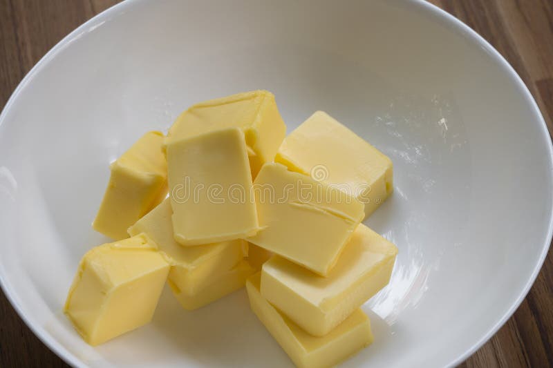 Butter Slices are Placed on a Plate, Cut Butter into Cubes for Baking ...
