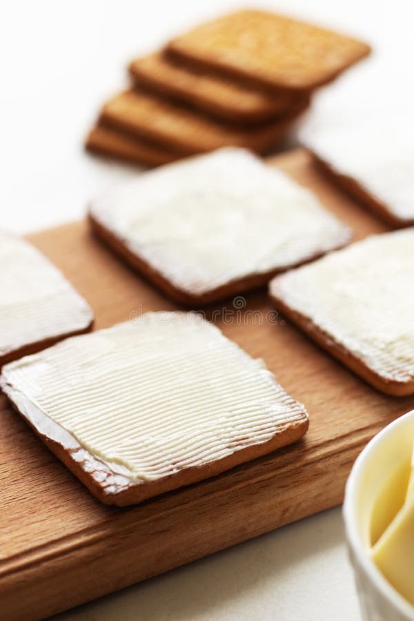 Butter Spread on Crispy Square Cookies Stock Photo - Image of dessert ...