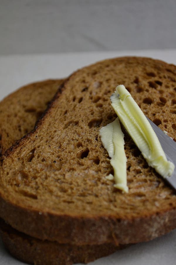 Butter Spread on Dark Bread Stock Image - Image of delicious, wooden ...