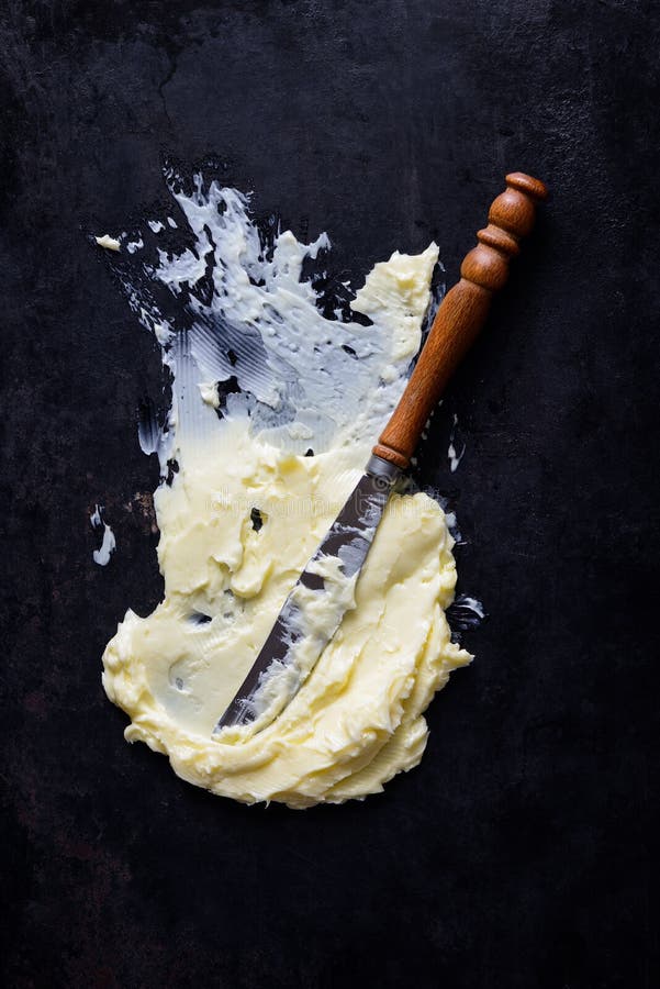 Butter Spread on a Dark Surface Stock Image - Image of messy, smear ...