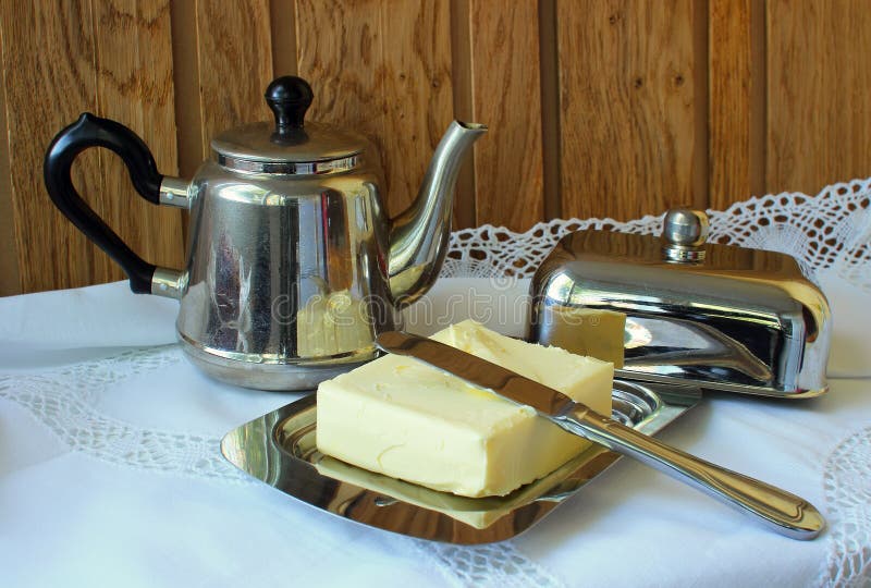 Butter and teapot for tea stock photo. Image of tablecloth - 44595962