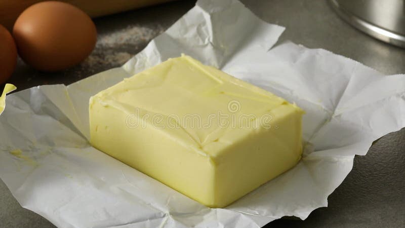 Butter Block Cutting. Big Stick of Butter Cutting. Slicing Butter Piece ...