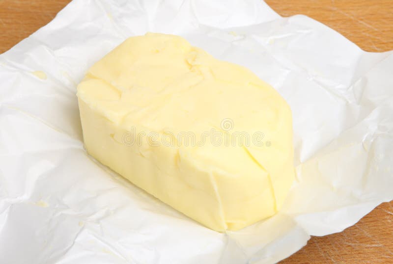 Butter in Wrapping Paper stock image. Image of fresh - 33622569