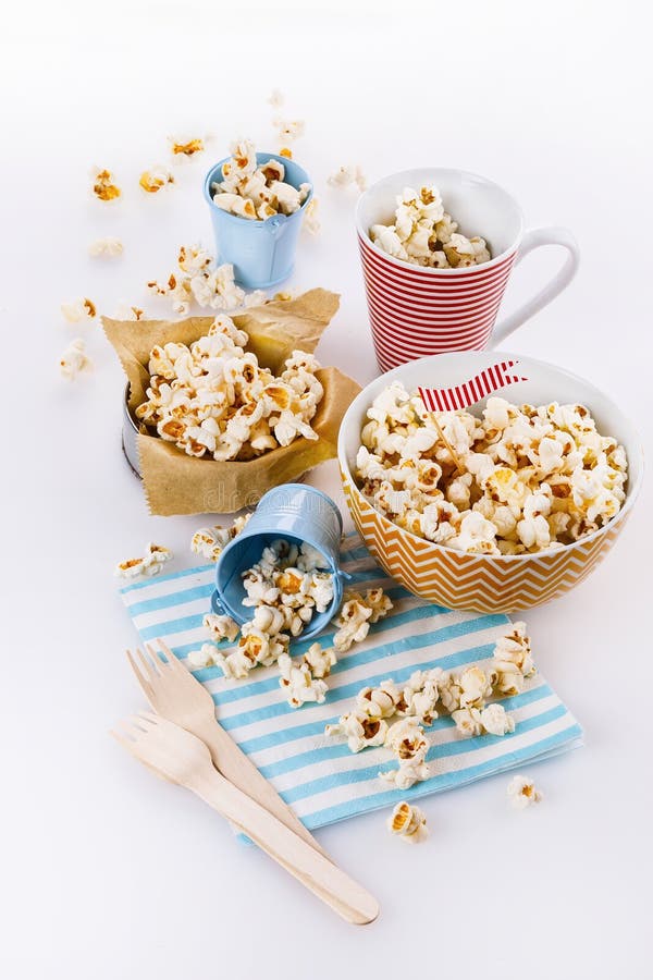 Buttered Popcorn in Striped Paper Cups Over White Background Stock ...