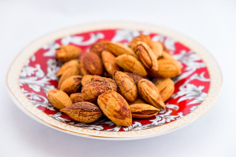 Buttered Roast Almond with Hard Shell on Plate Stock Image - Image of ...