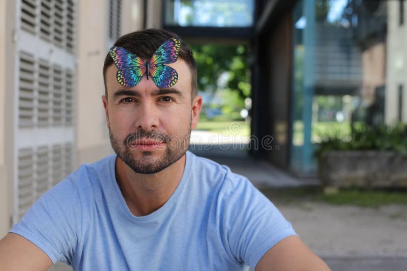 Butterfly with the Rainbow Colors Landing on a Handsome Man´s Face ...