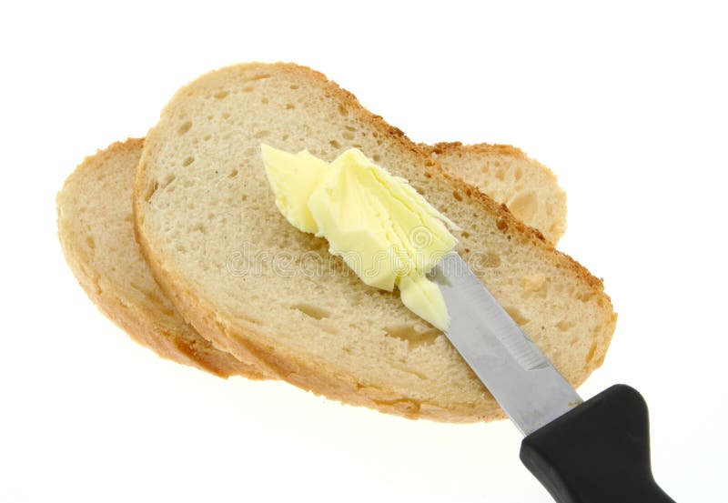 Spreading butter on bread stock photo. Image of piece - 19317562