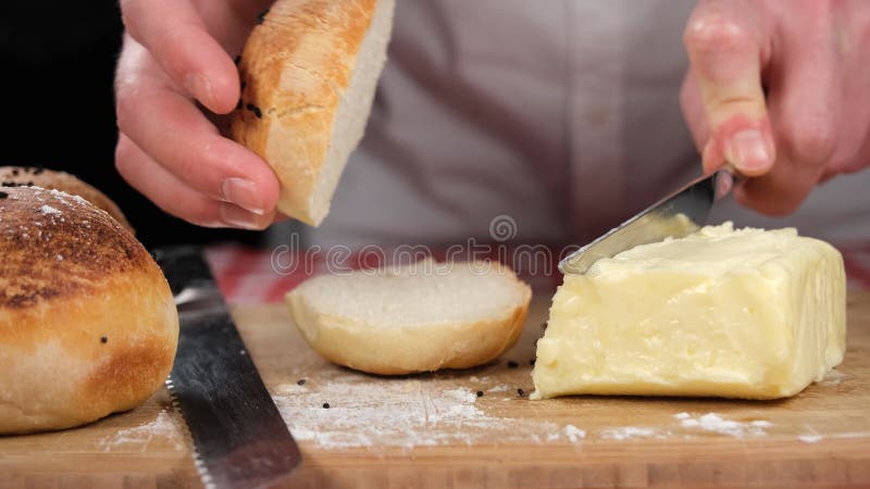 Buttering the bread stock footage. Video of knife, meal - 278229446