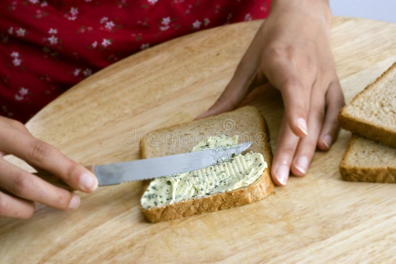 Buttering bread stock photo. Image of enegry, knife, hand - 212234 Buttering bread stock photo. Image of enegry, knife, hand - 212234