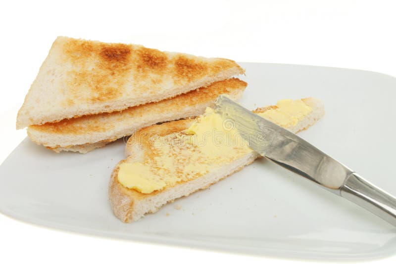 Buttering toast stock image. Image of bread, golden, crust - 13084515