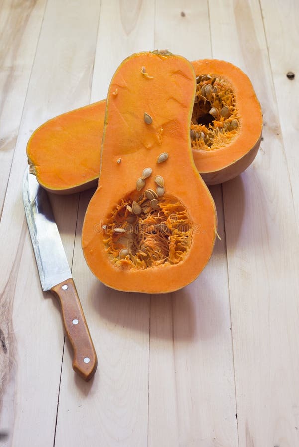 Butternut Squash Cut in Half on a Wooden Surface Stock Image - Image of ...