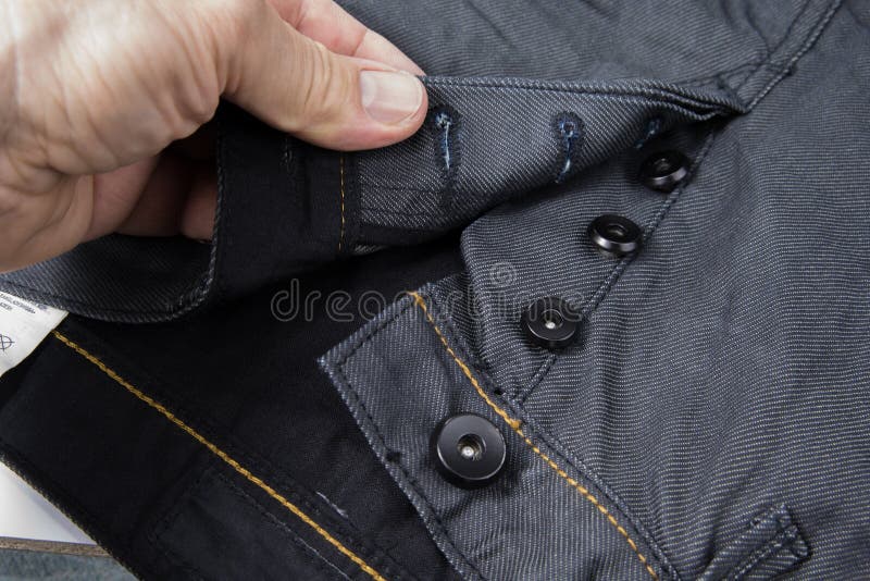 Button fly on a new jeans stock image. Image of textile - 334025913