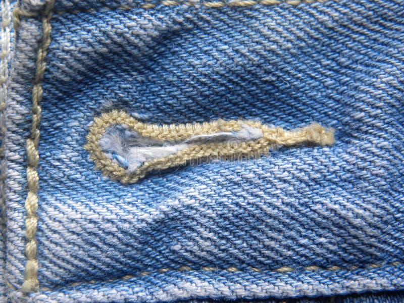Button hole on blue jeans stock photo. Image of detail - 144893170