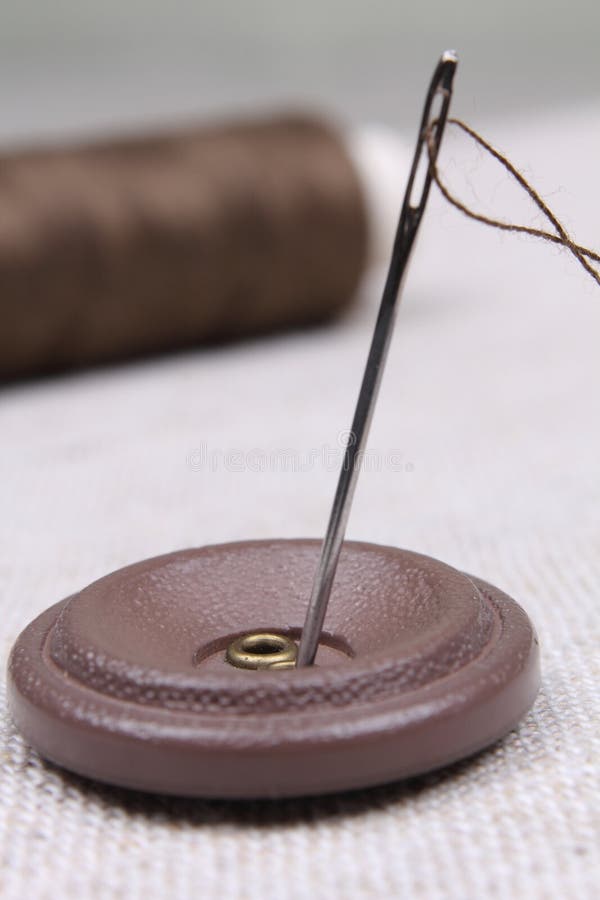 Button and Needle with a Thread Stock Image - Image of pricked, fabric ...