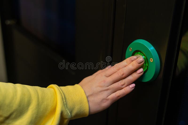 Button for Opening Doors on the Train. Close-up of Female Hands on the ...