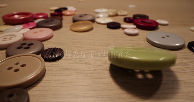 Button for Sewing. Button Spin on the Table. Concept of Extreme Macro ...