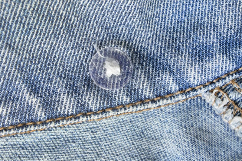 Button sewn on denim stock image. Image of blue, denim - 236936093