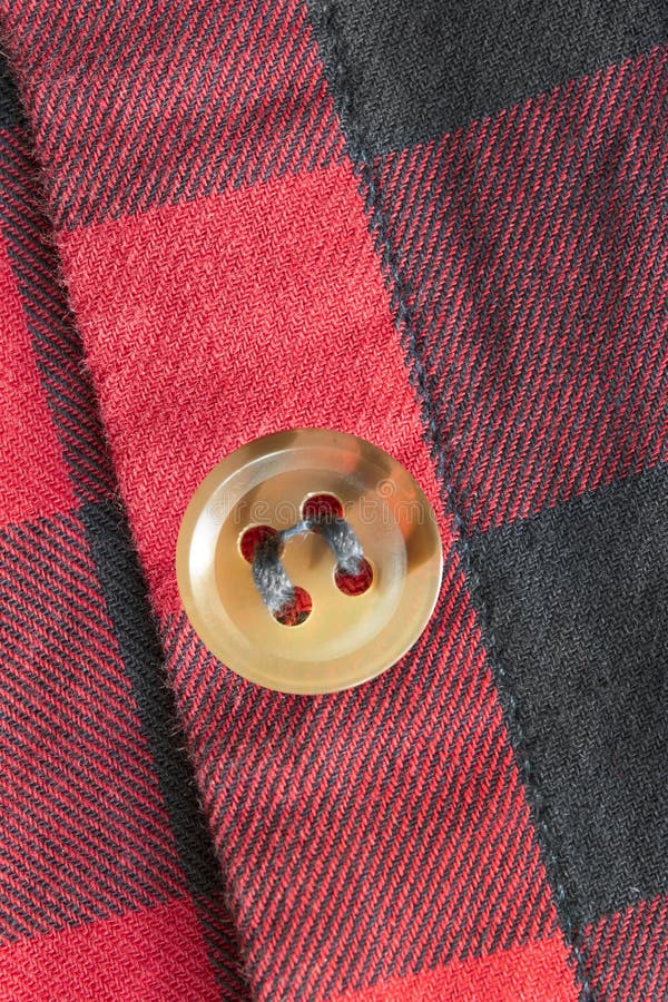 Button sewn on fabric stock photo. Image of needlework - 236936160