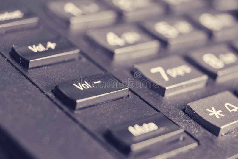 Button with Text Volume and Mute on a Landline Phone in the Office, Clo ...