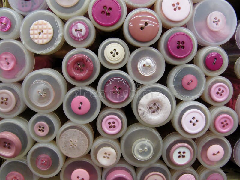 Pink Buttons in Tube Displays on a Store Shelf Stock Image - Image of ...