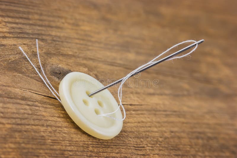 Buttons with Needle and Thread Stock Image - Image of background ...
