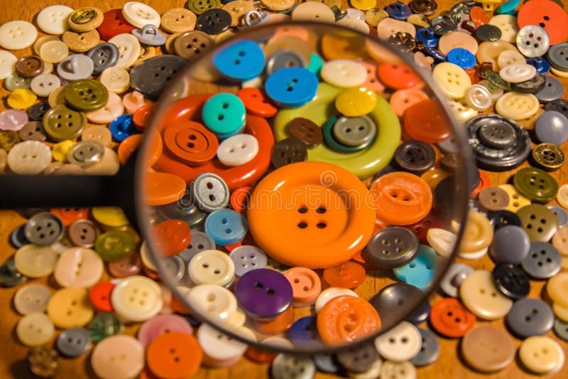 Buttons Over the Visible Magnifying Glass Stock Image - Image of ...