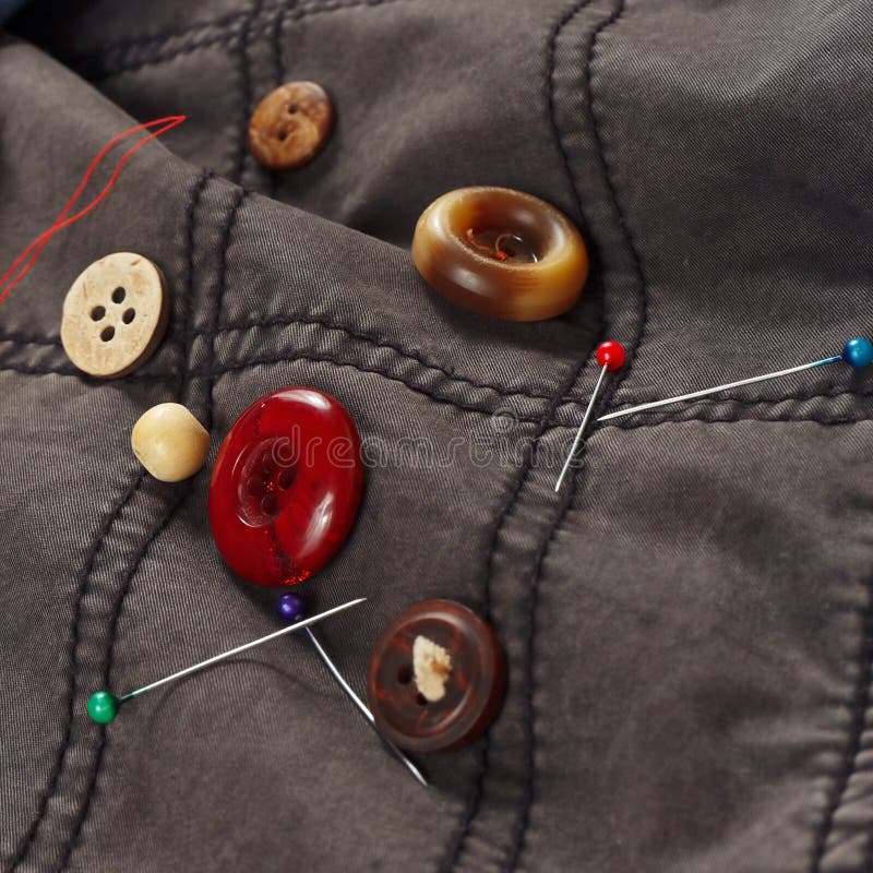 Buttons, Pins and Needles with Threads on Background of Cotton Clothes ...