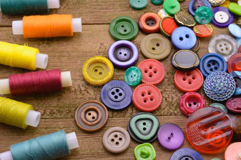 Buttons and threads stock photo. Image of handful, multicolored - 71874096