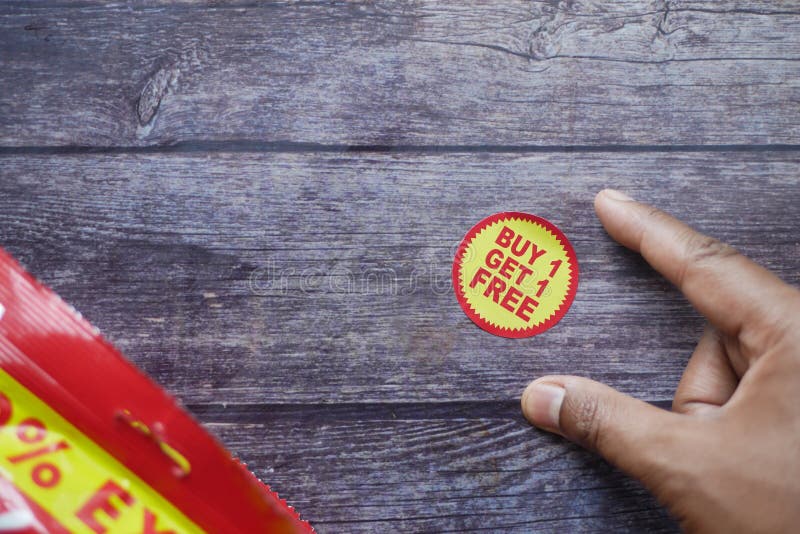 Buy 1 Get 1 Free Offer Sticker and Prodcuts on Table Stock Image ...