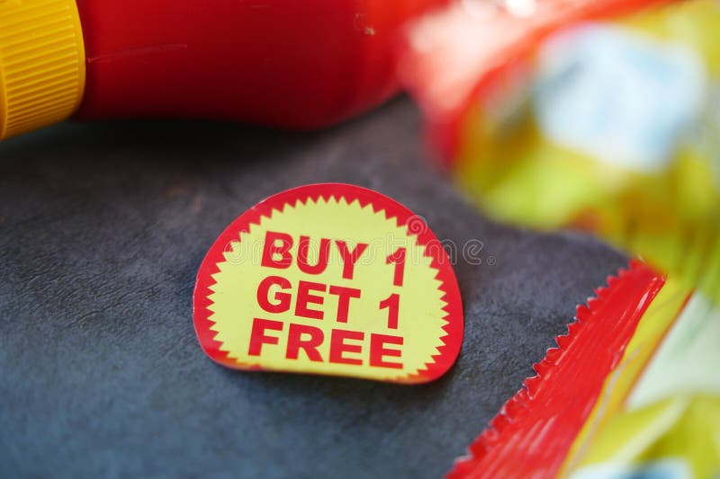 Buy 1 Get 1 Free Offer Sticker and Prodcuts on Table Stock Photo ...