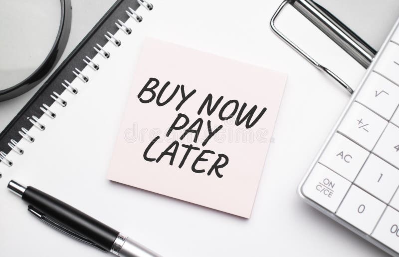 BUY NOW PAY LATER. Notepad, Eyeglasses and White Pen Stock Photo ...