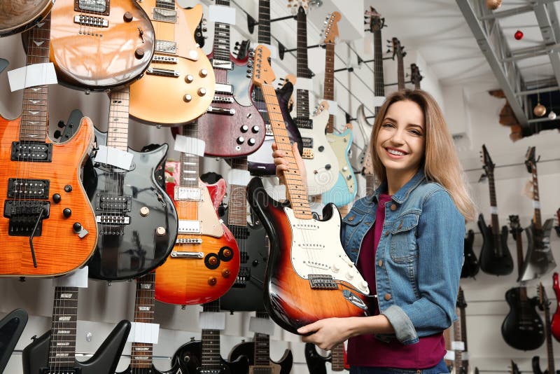 Buyer Choosing Guitar in Music Store Stock Photo - Image of client ...