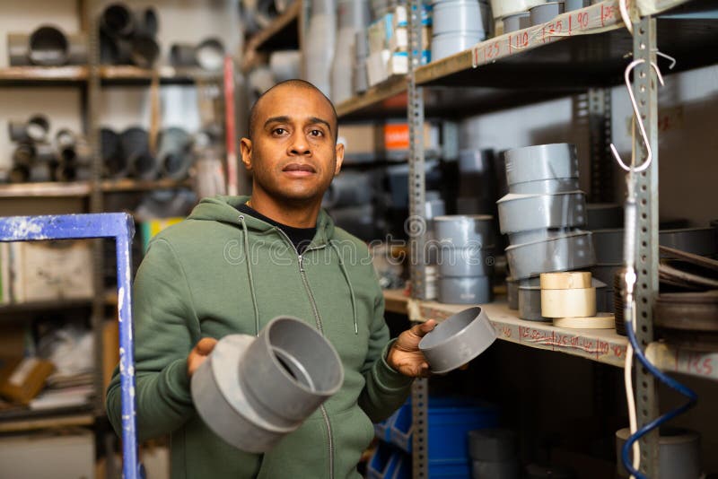 Buyer Selects Plumbing Fittings at Hardware Store Stock Image - Image ...