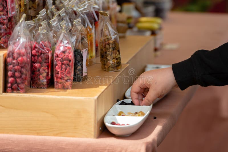 The Buyer Will Take Candy from the Bowl of Sweets Tasting Sample Stock ...