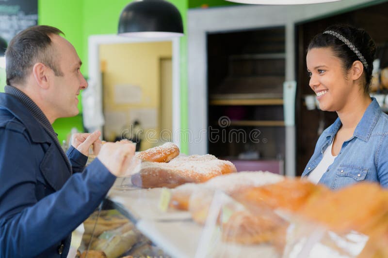 Buying bread from bakery stock photo. Image of executive - 267510996
